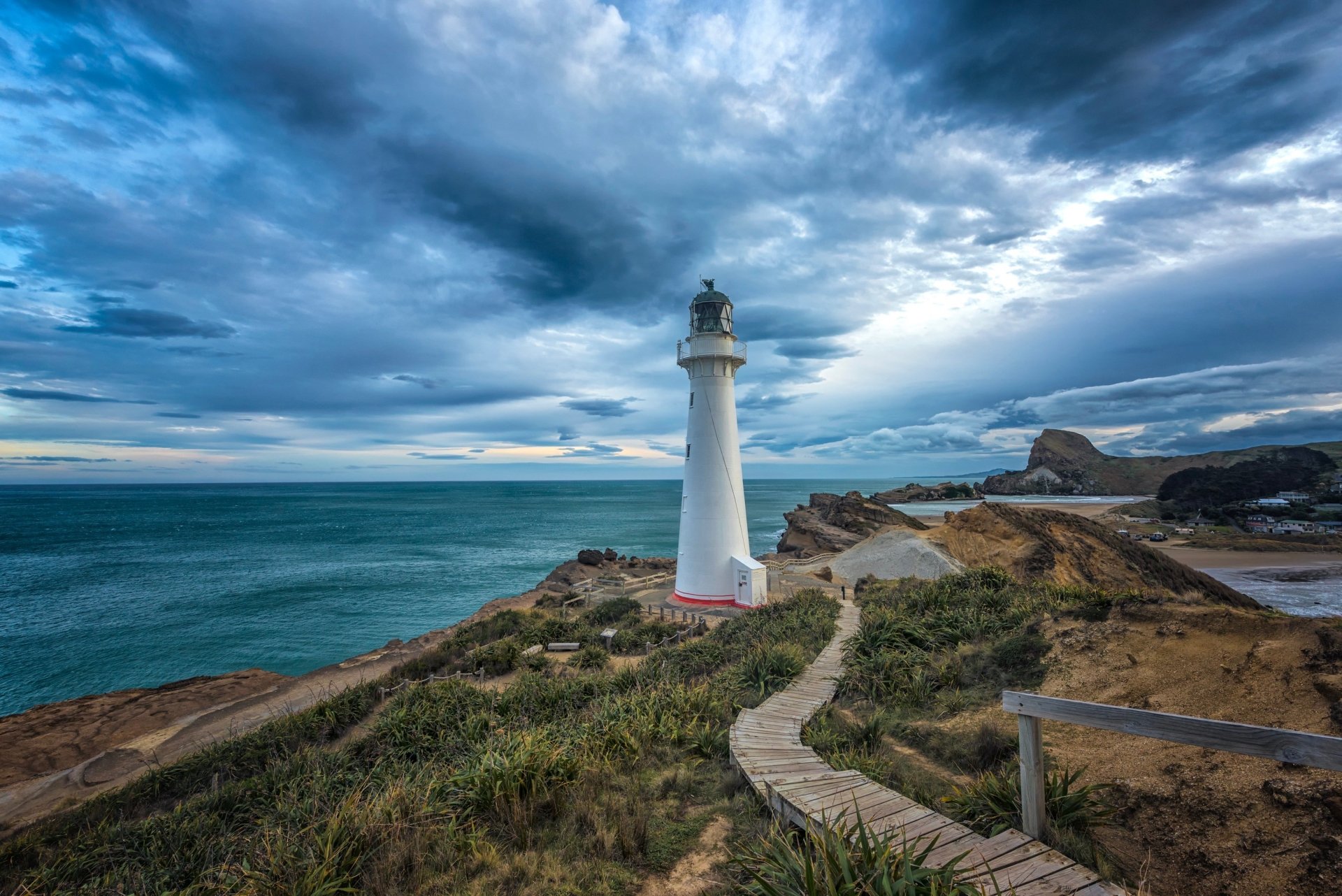 Majestic New Zealand Lighthouse Overlooking Ocean Horizon and Clouds ...