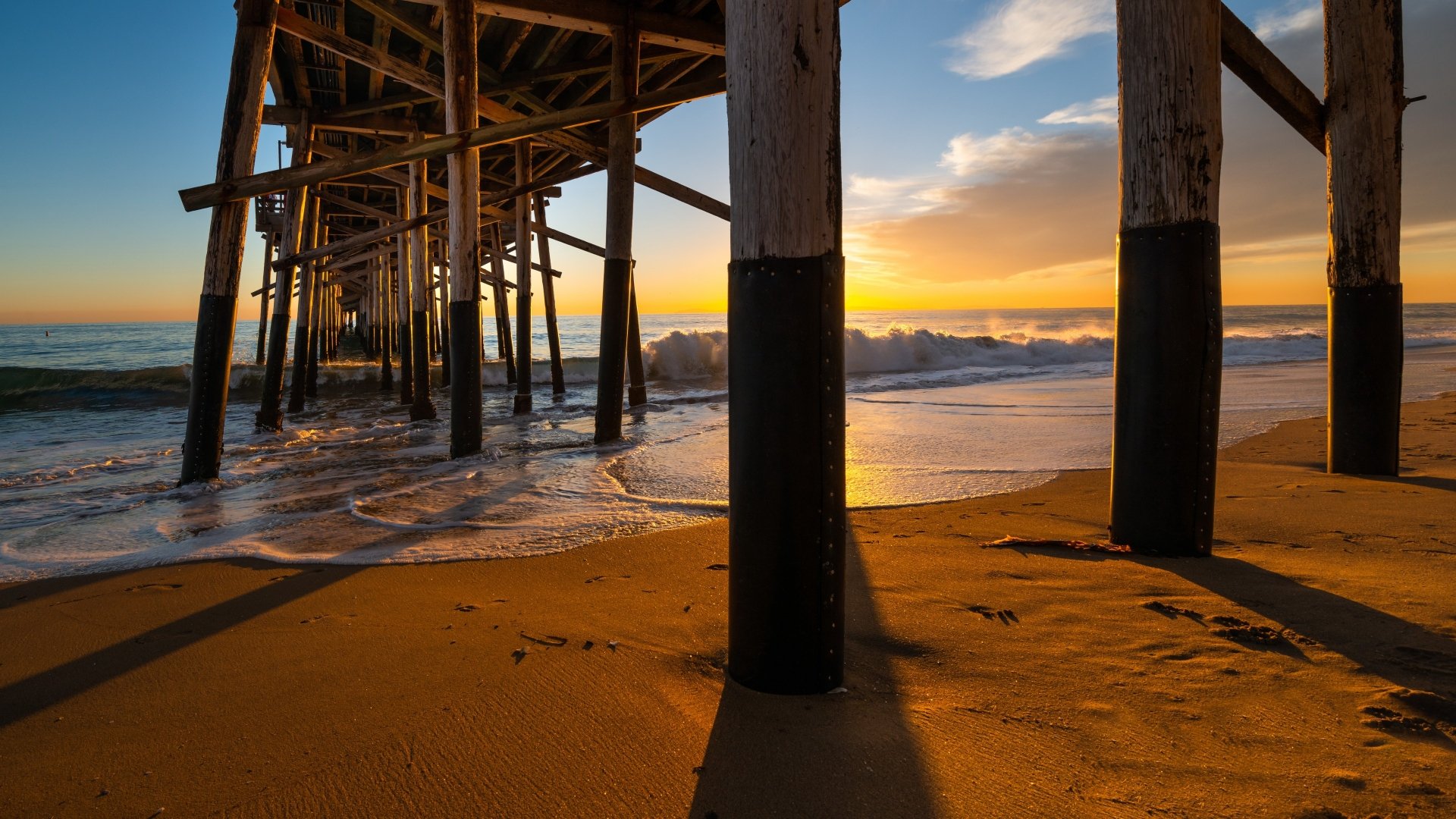 4K Ultra HD Pier — Golden Sunset Beneath the Man-Made Boardwalk ...