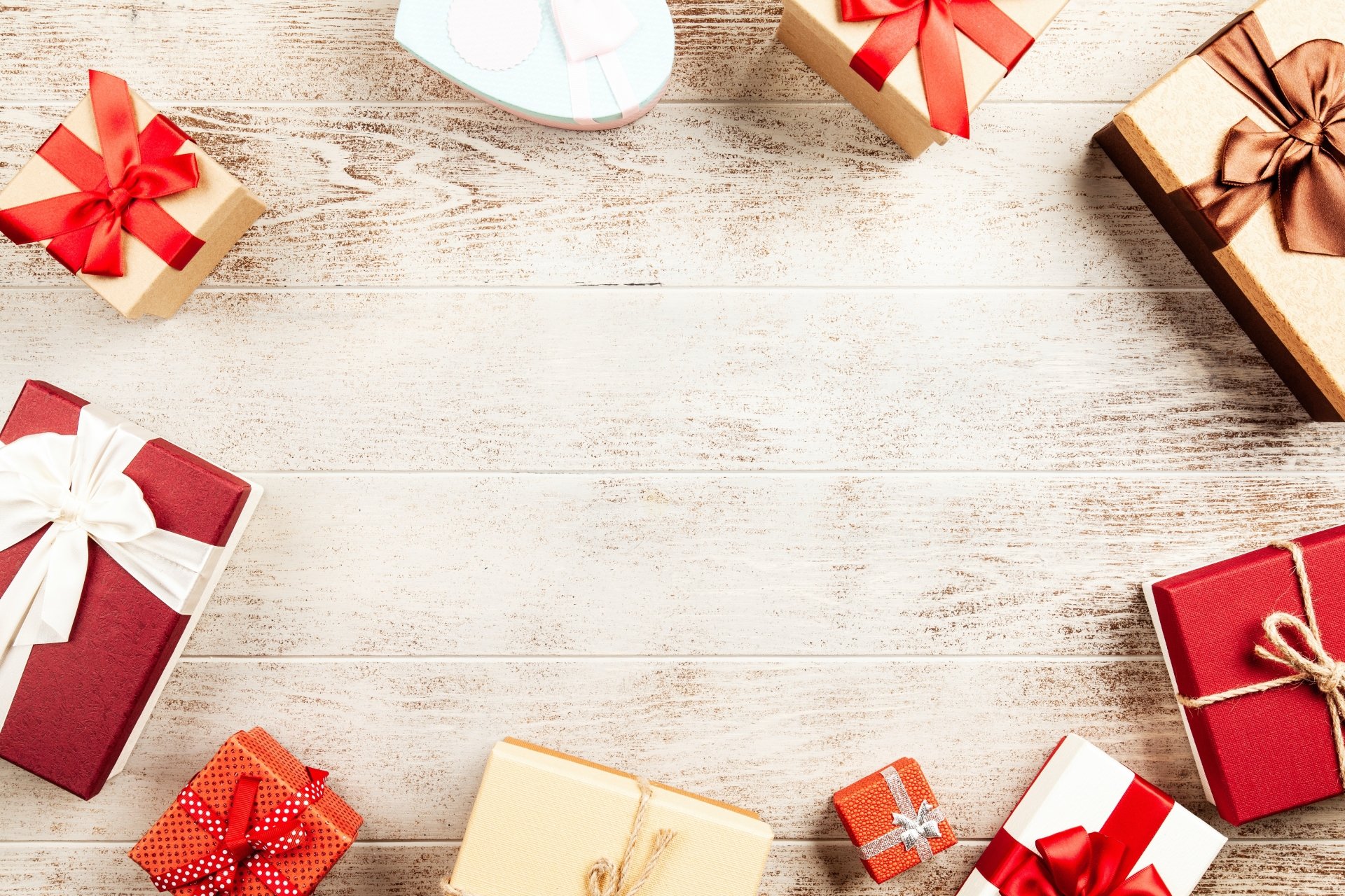 5K Ultra HD Gift Wallpaper — Wrapped Presents on White Wood