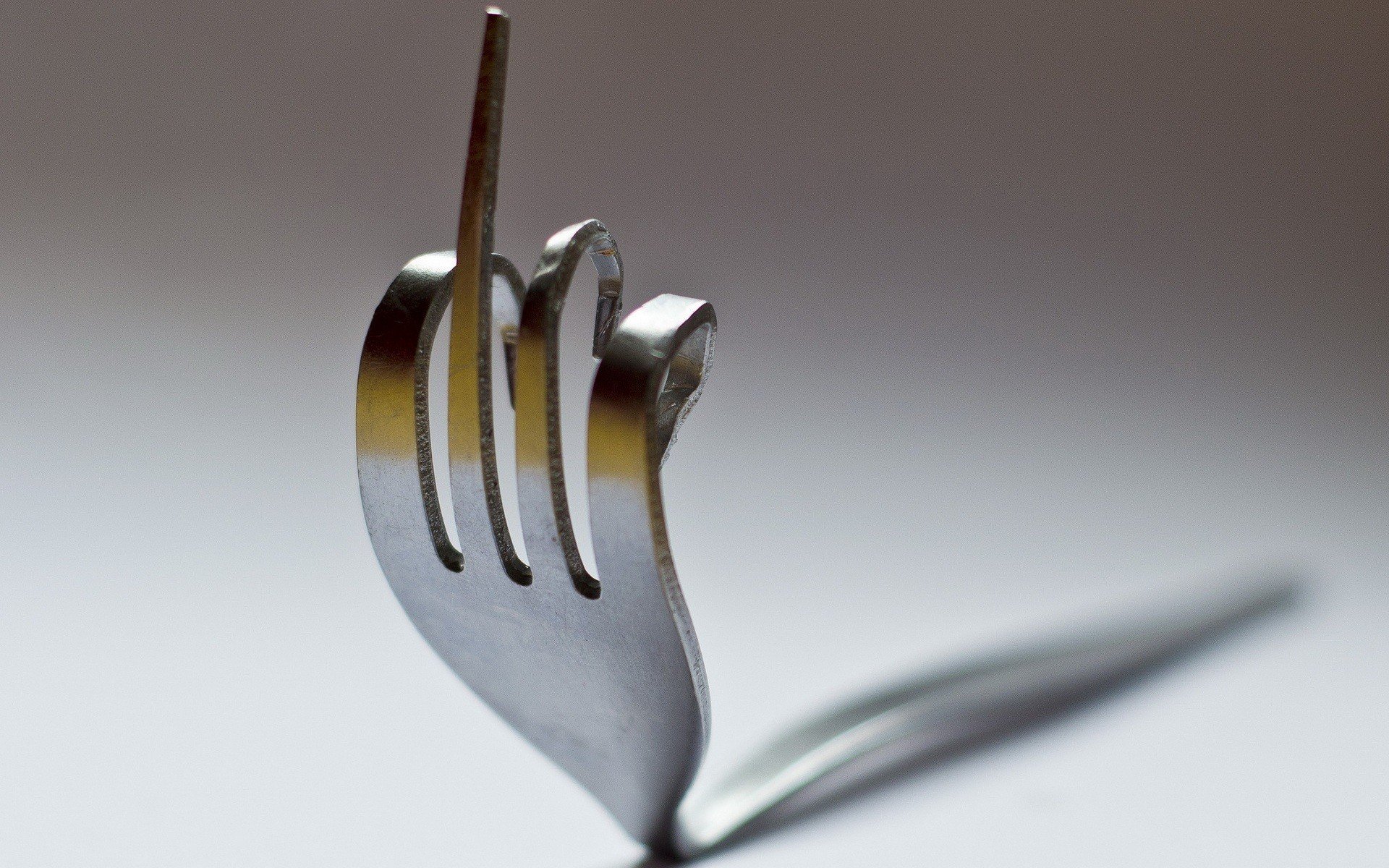 Witty Fork Flip: HD Humor in Everyday Objects