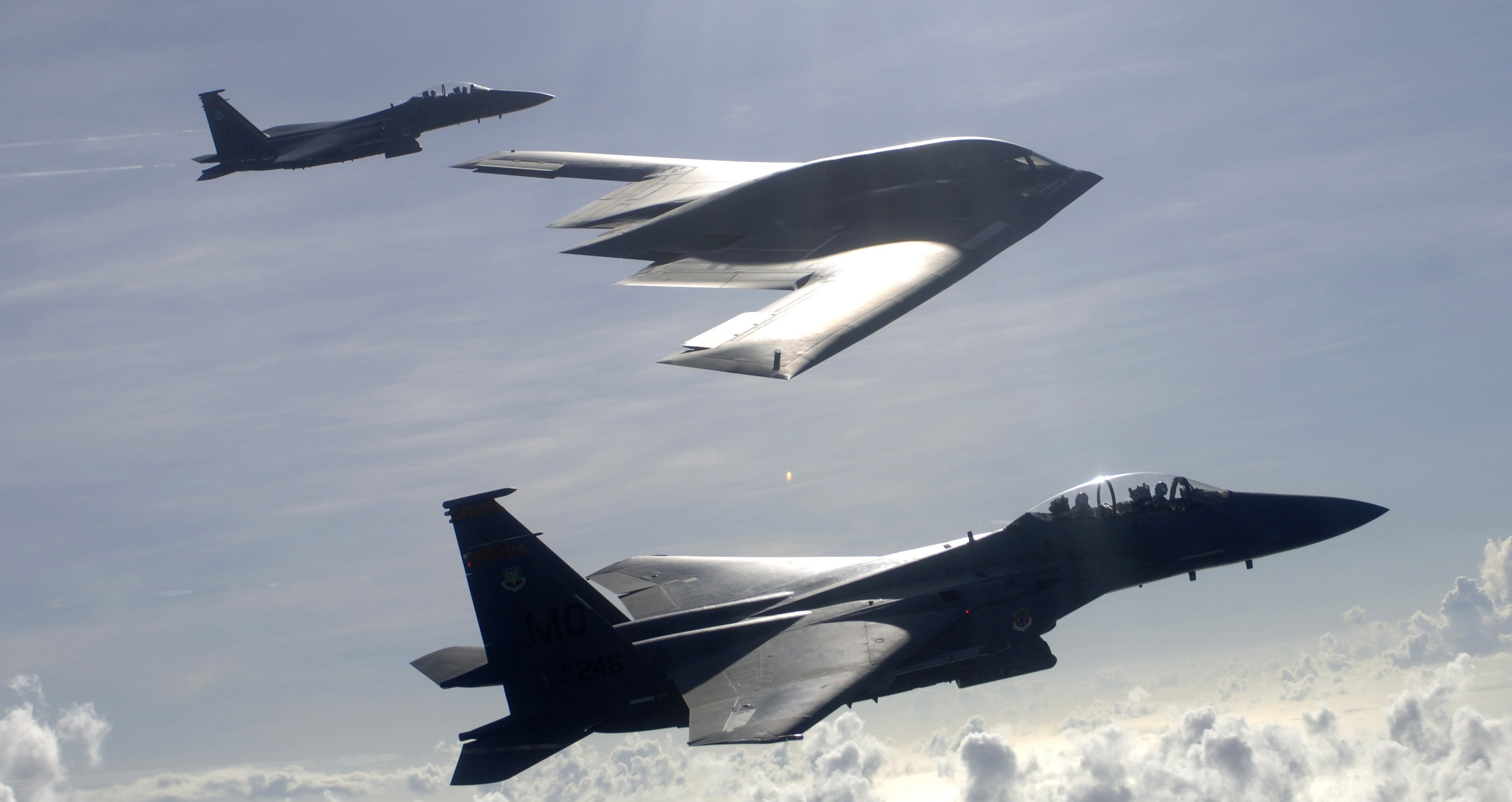 Supreme Skies: F-15 Eagle and B-2 Spirit in HD Military Flight Wallpaper