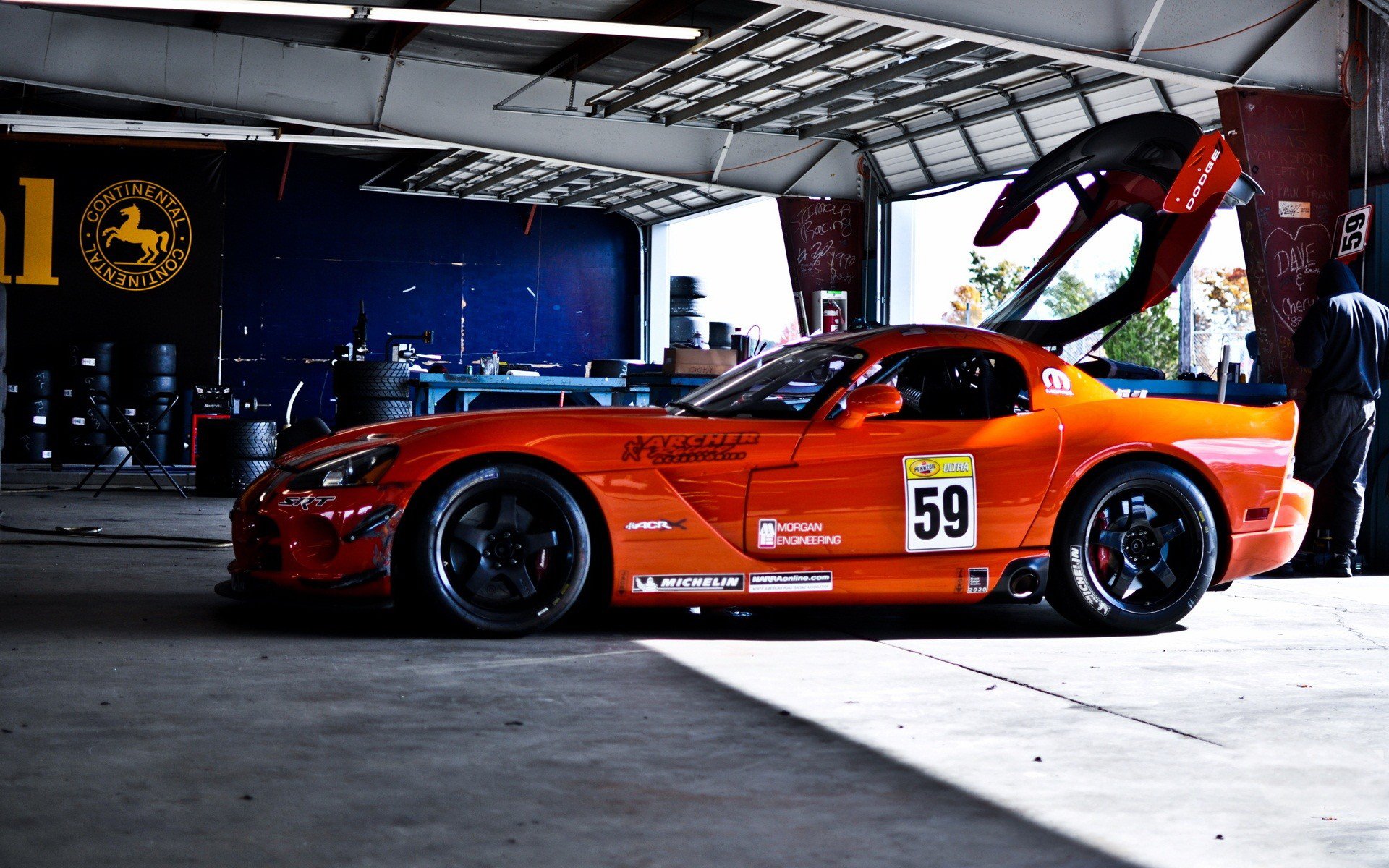 HD Wallpaper: Sleek Orange Dodge Viper Beast in Garage Spotlight