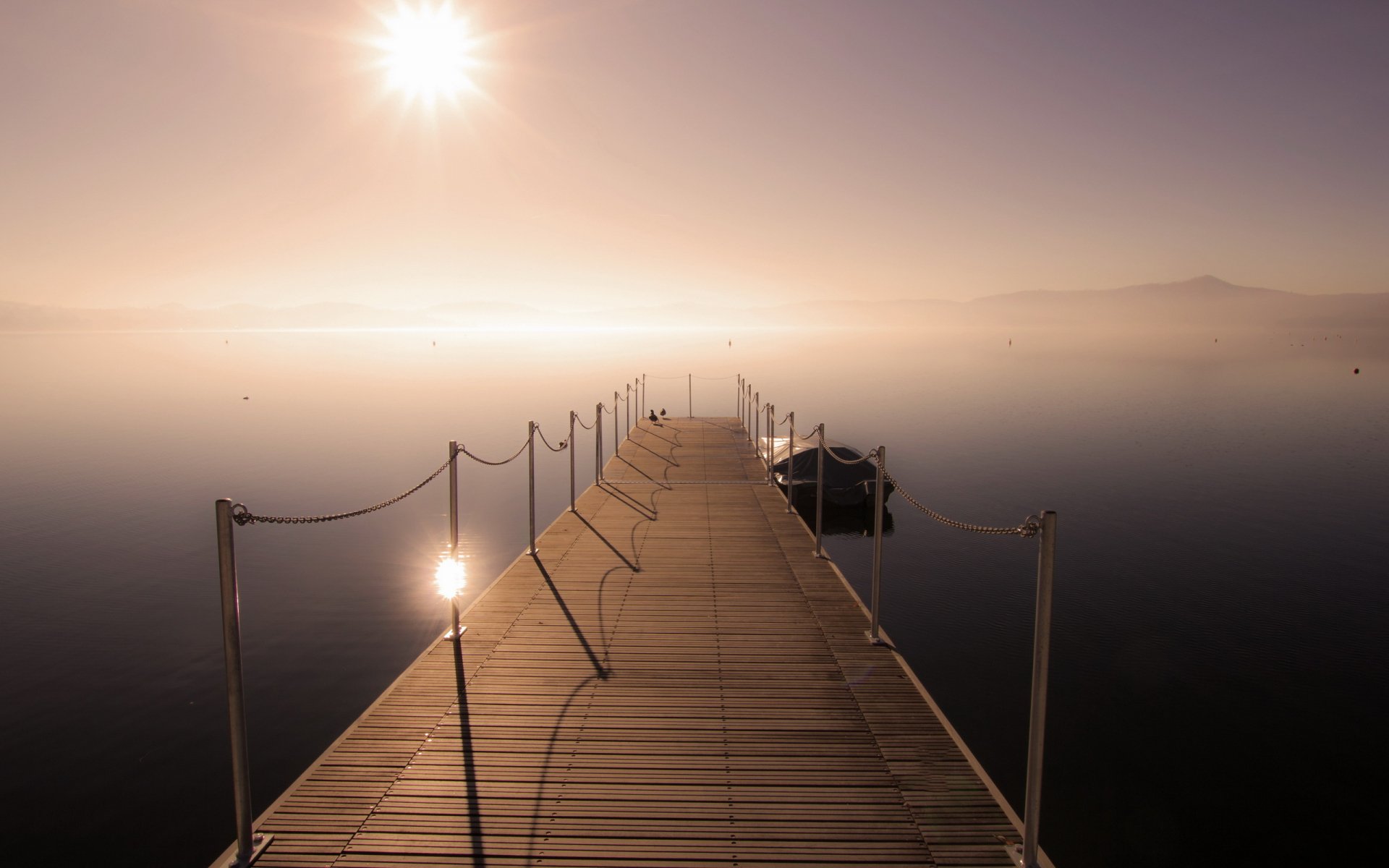 Serene Sunrise over Man-Made Pier | HD Wallpaper