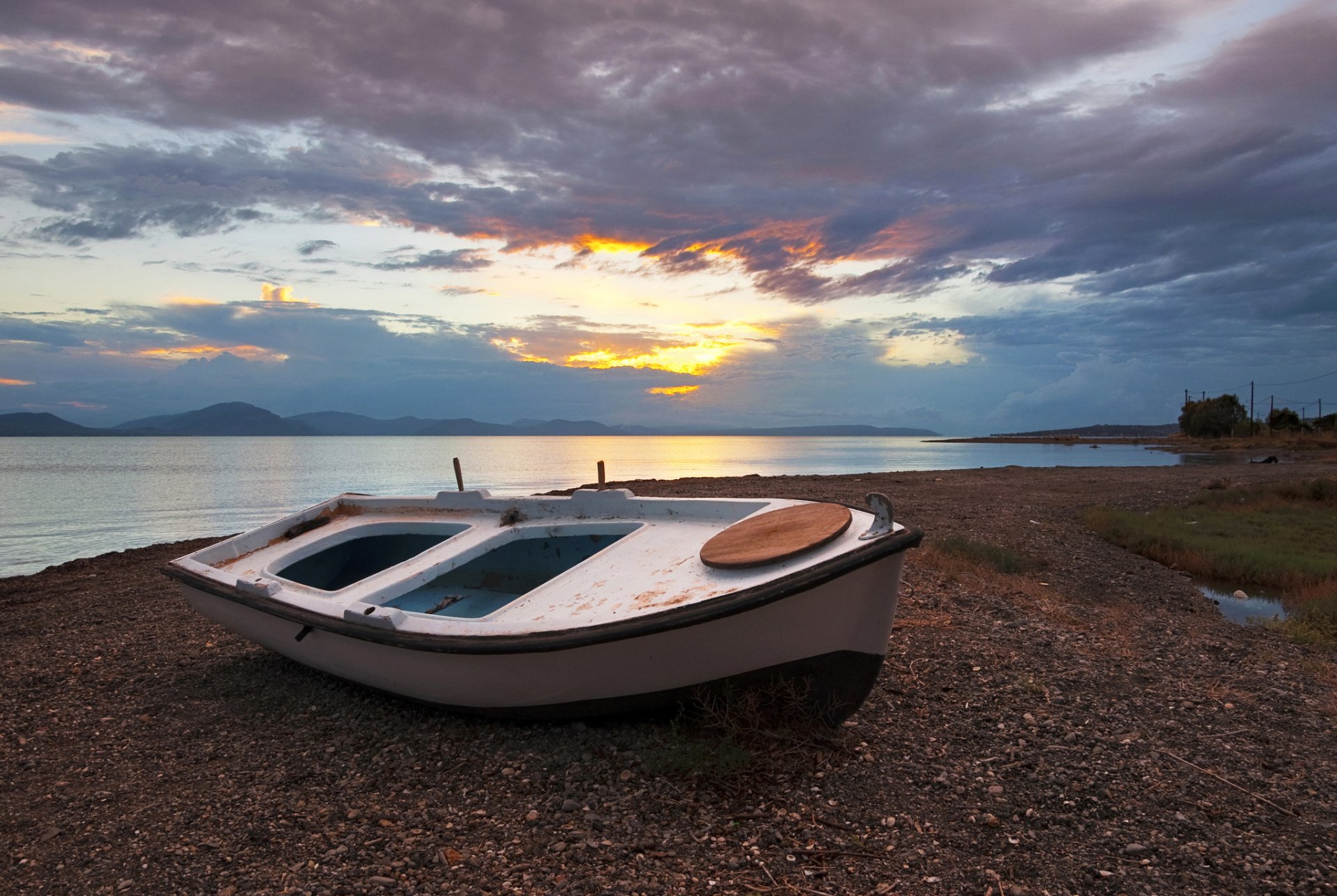 Beached Rowboat at Sunset — HD Wallpaper