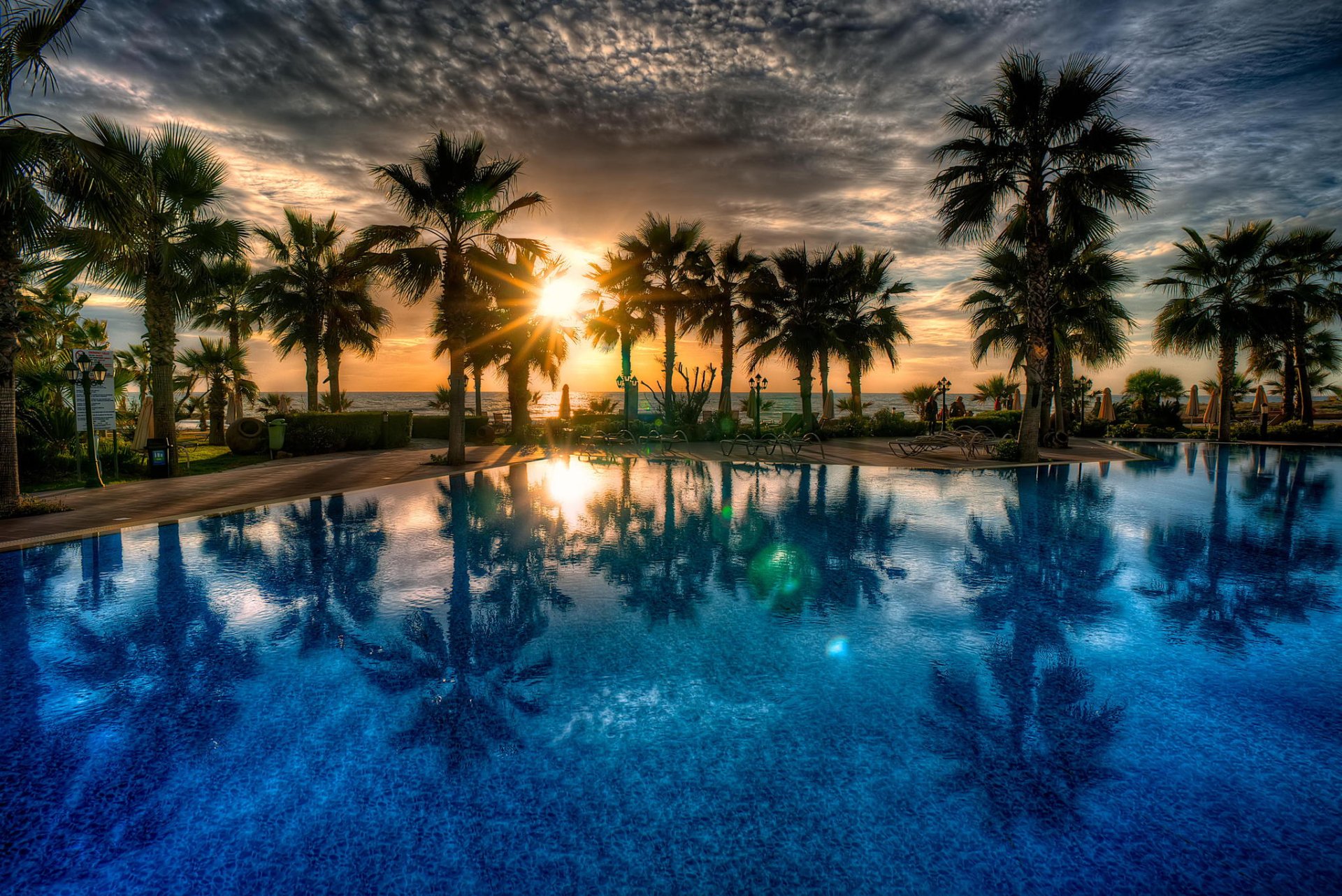 Sunset Serenity at the Man-Made Resort Pool – HD Wallpaper Bliss