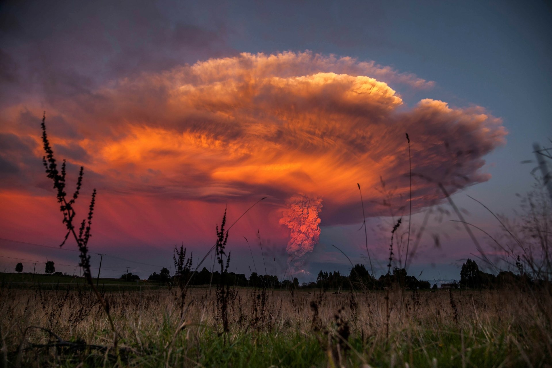 4K Ultra HD Volcano Eruption Over Serene Grassland Landscape Wallpaper ...