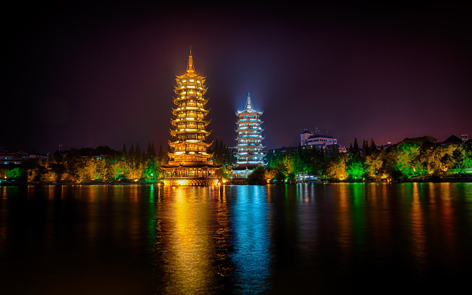 Night Reflections: Illuminated Pagodas HD Wallpaper