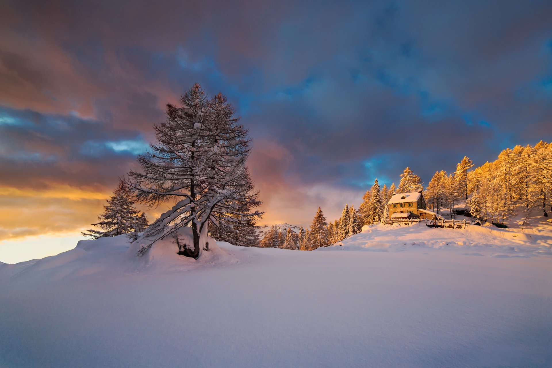 Winter Serenity: Snow-Covered Hills and Cozy House HD Wallpaper