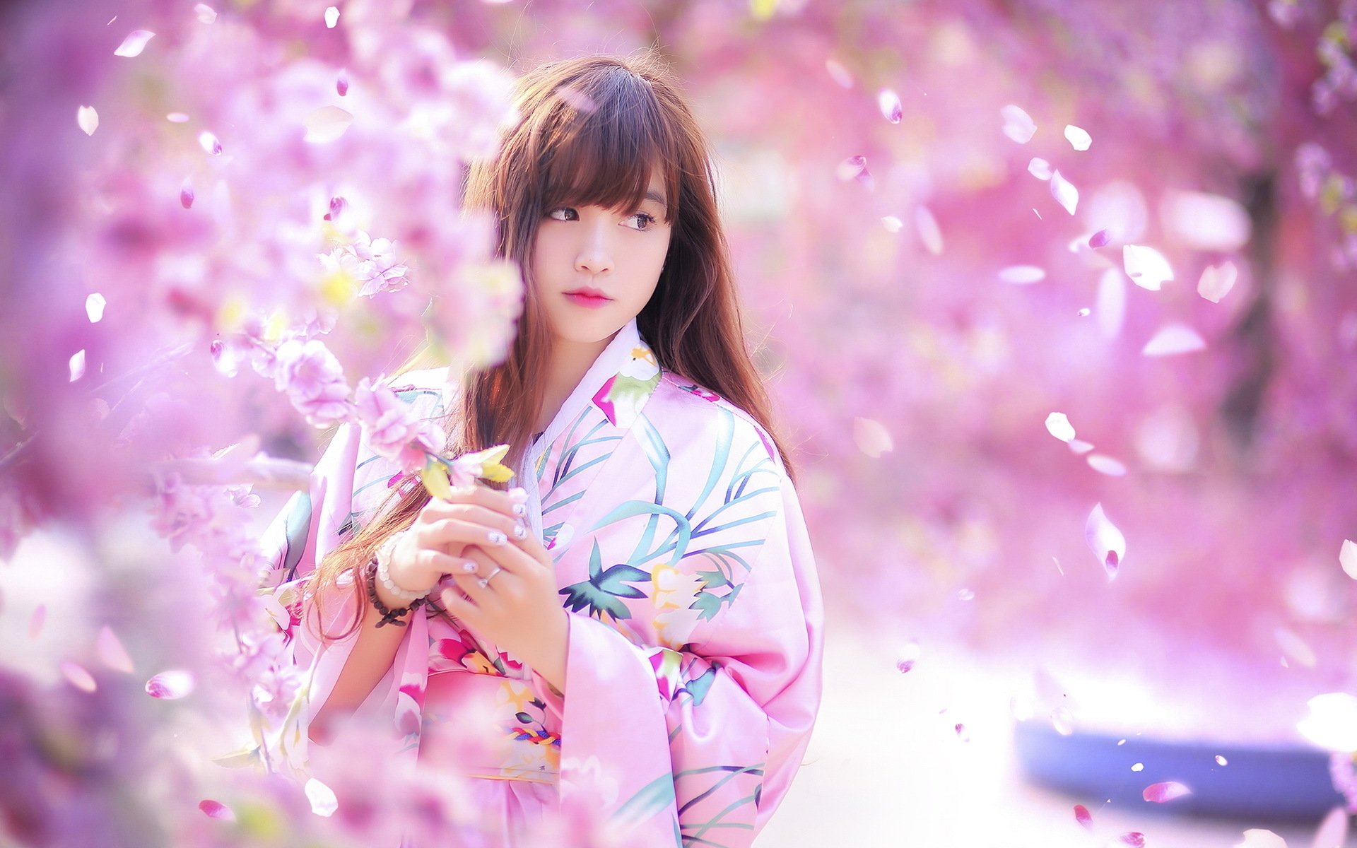 Blossoming Elegance: Asian Beauty in Kimono Amid Pink Petals and Soft ...