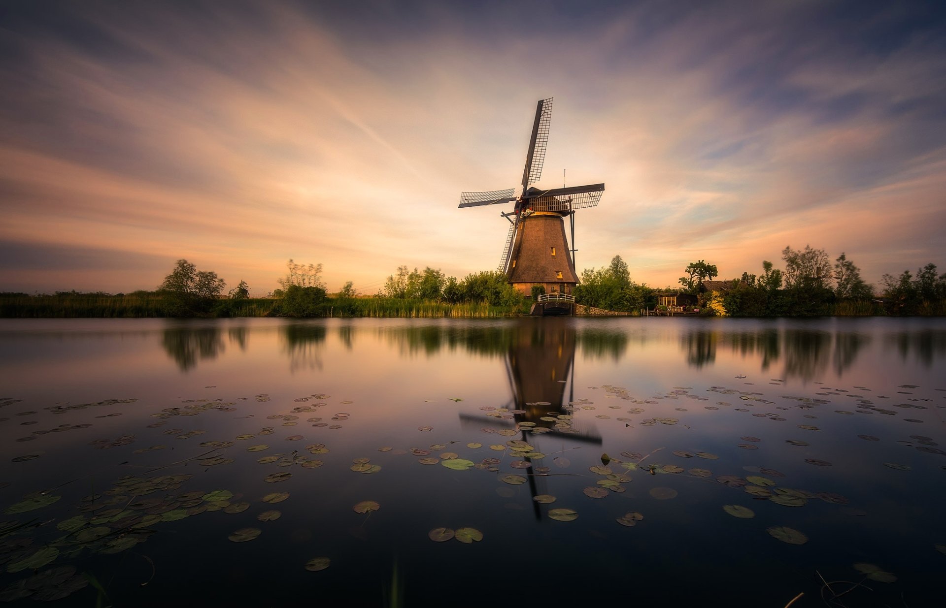 Tranquil Windmill Reflection over Serene Lake – HD Scenic Wallpaper