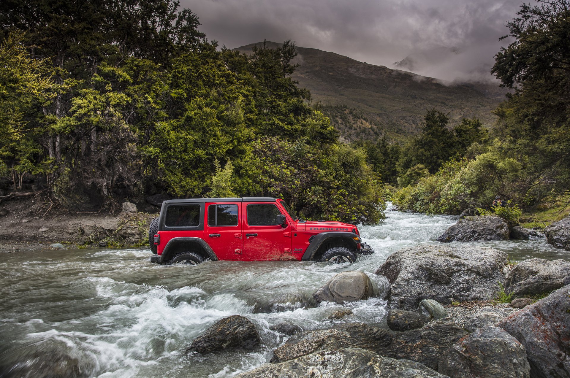 Jeep Wrangler SUV Conquering a Mountain River – HD Adventure Wallpaper
